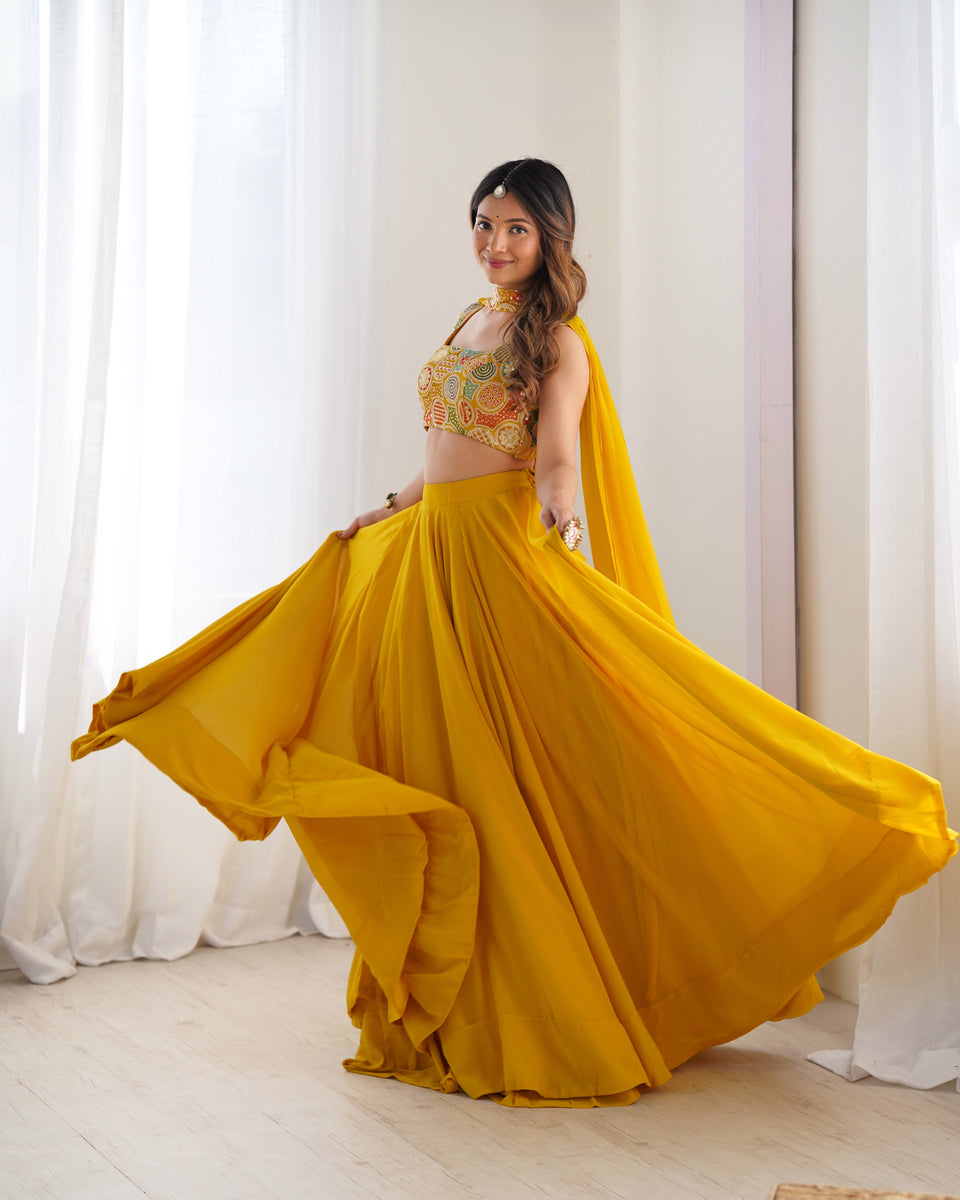 Yellow flowy lehenga with multicolor choli and matching dupatta ...